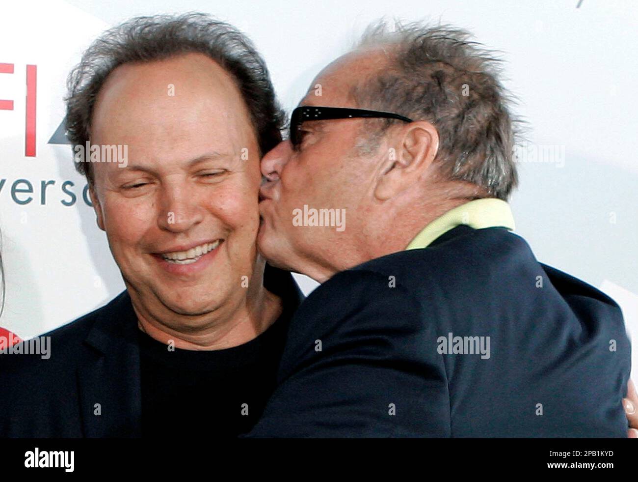 Actor Jack Nicholson, right, kisses Billy Crystal as they arrive at AFI ...