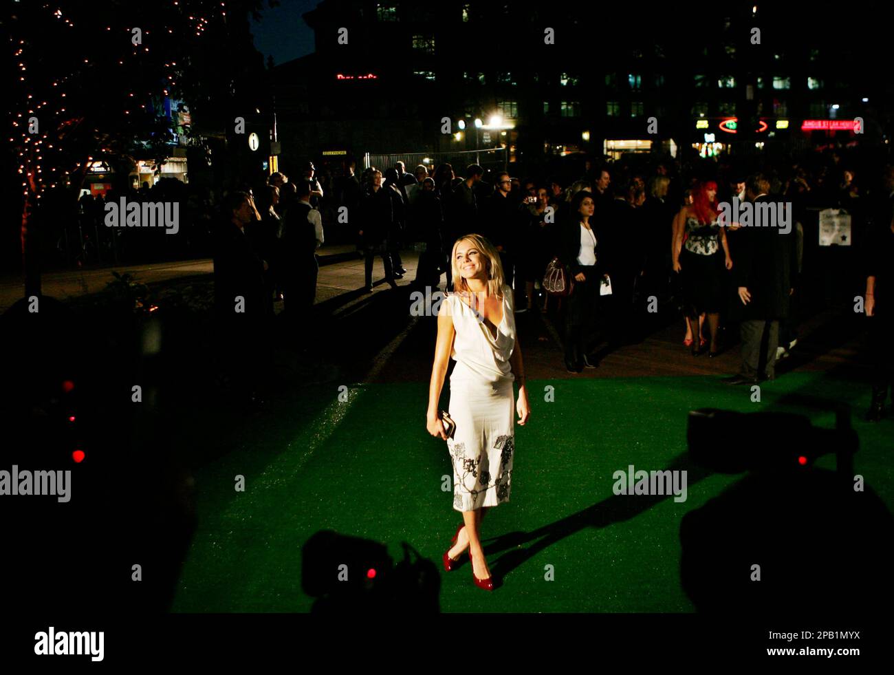 British actress Sienna Miller poses for photographers as she arrives ...