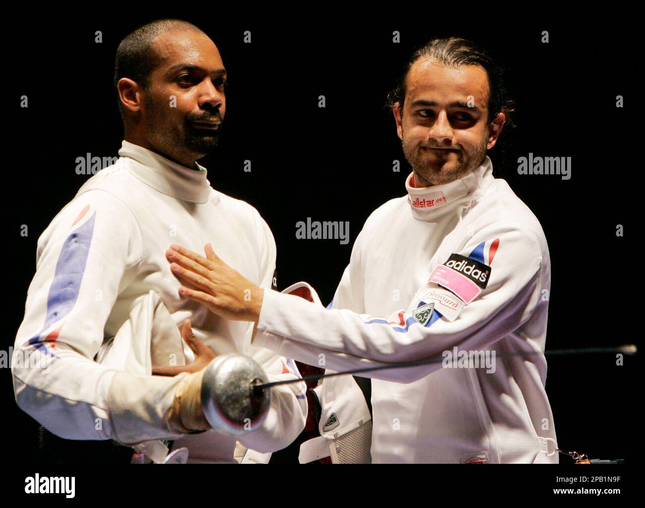France's Jerome Jeannet, left, and his teammate Eric Boisse seen after ...