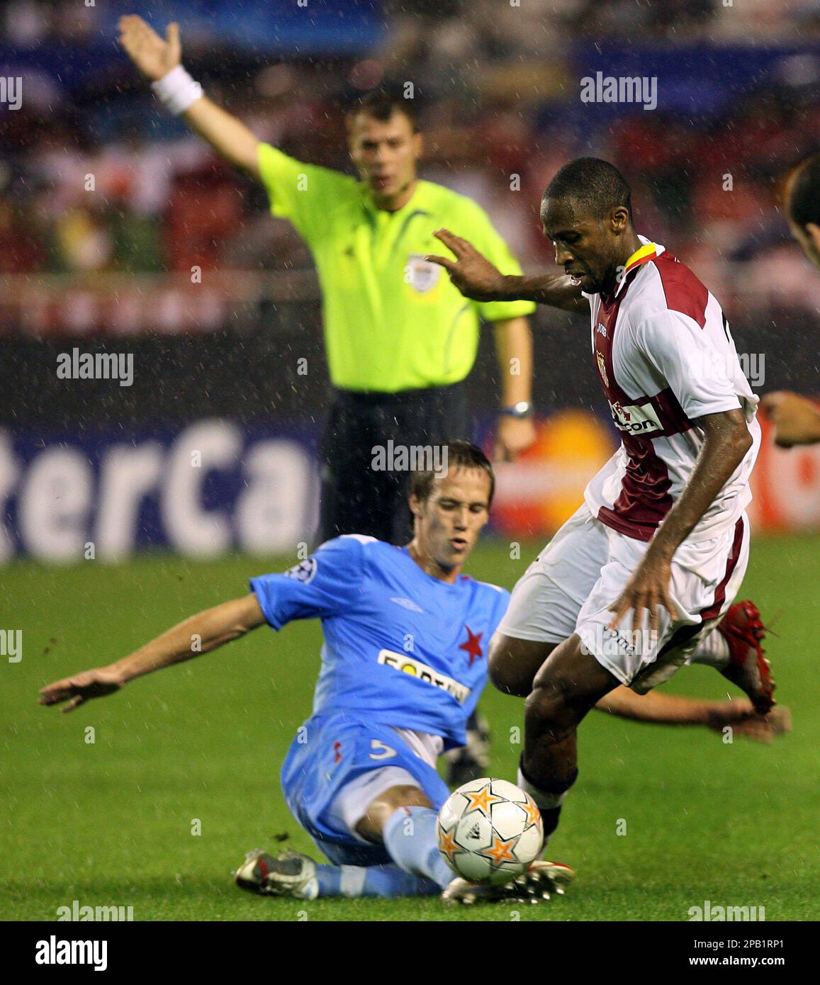 Slavia Prague's Michal Svec, left, and Sevilla's Seydou Keita duel for ...