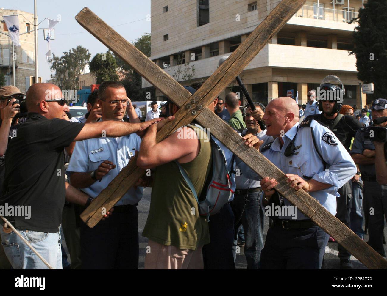 Israeli police officers scuffle with Christian pilgrim Joseph Matthew ...