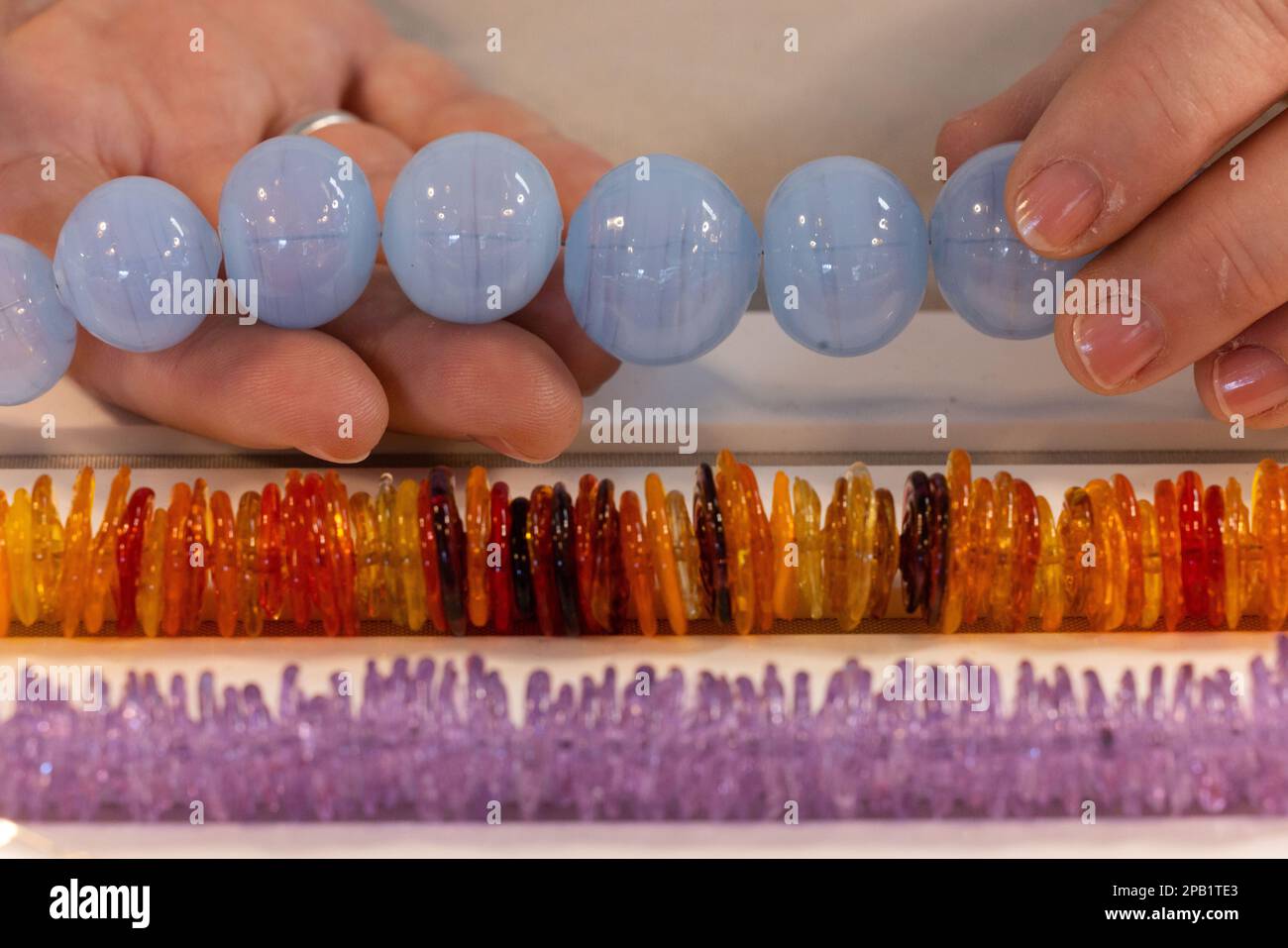 Lauscha, Germany. 12th Mar, 2023. Jewelry made of glass is presented at ...