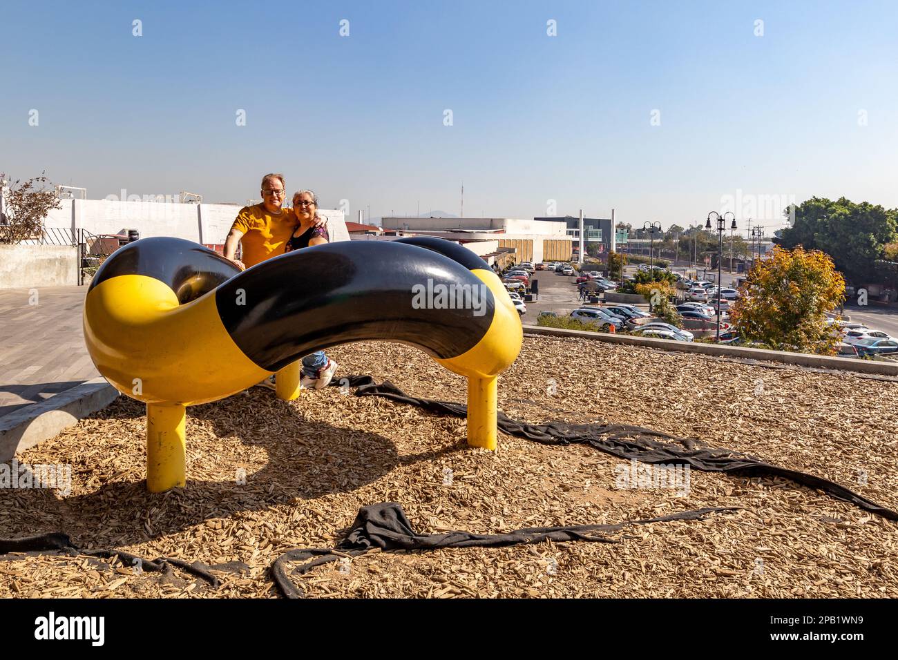 Playground in family public area in a shopping center, senior couple ...
