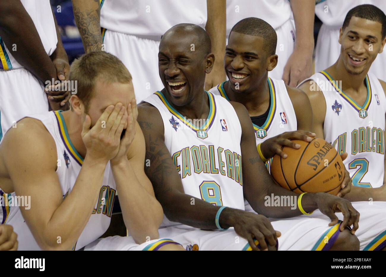 New Orleans Hornets' Adam Haluska, left, covers his face as Bobby ...