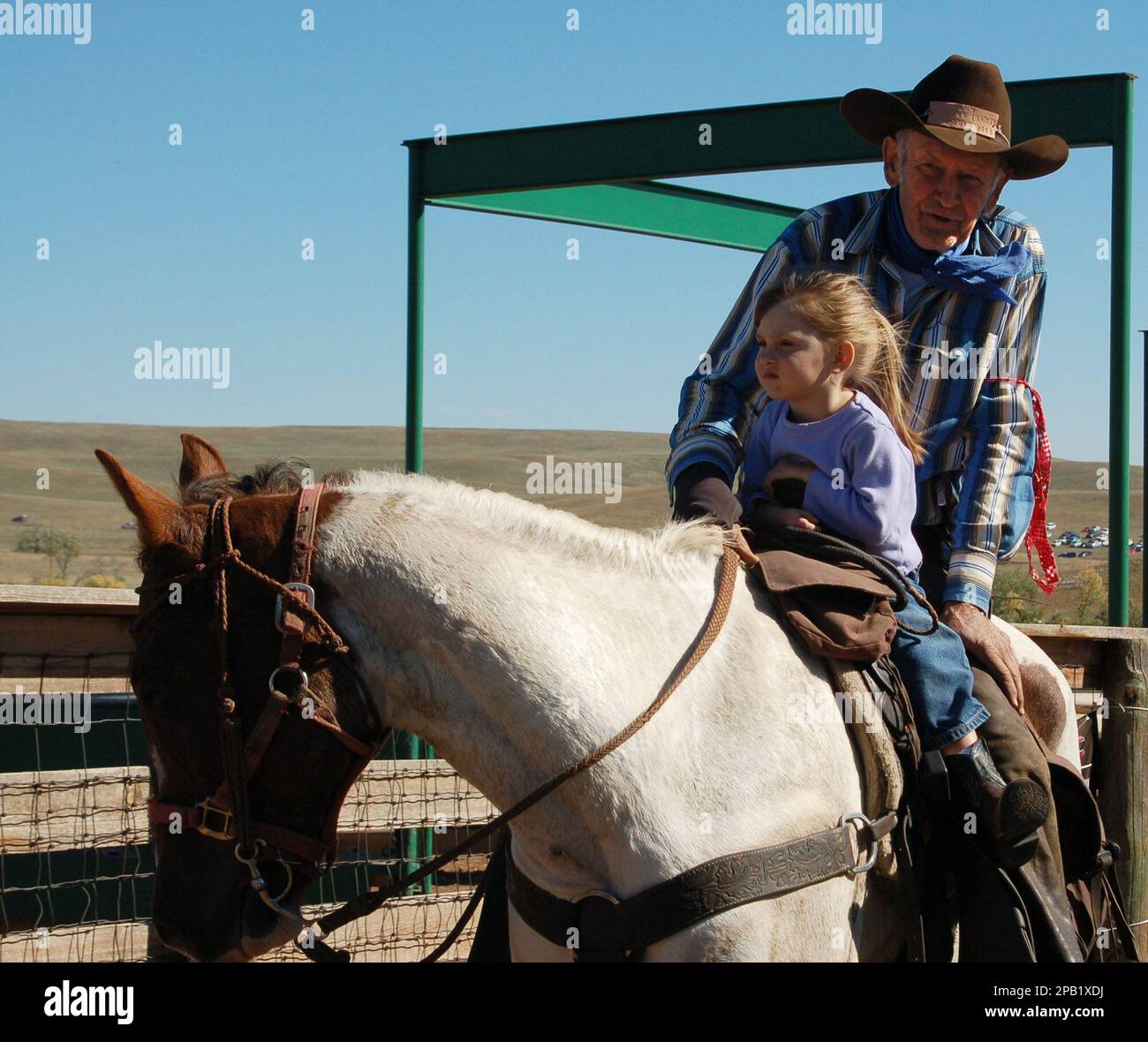 Bob Lantis gives his granddaughter, Haley Gruba, a ride on his horse he ...