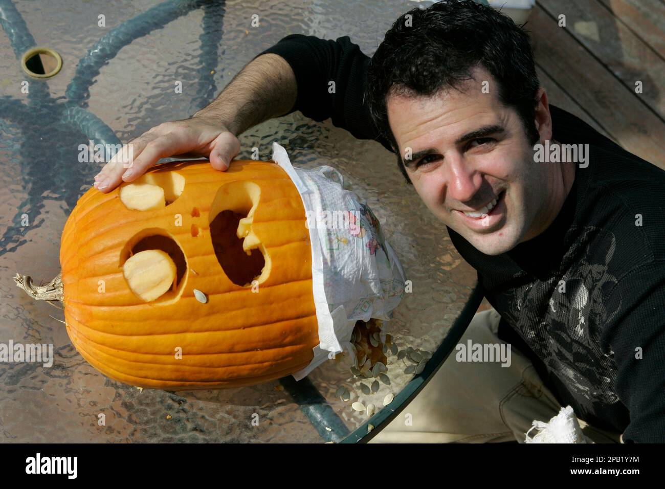 ** FOR USE WITH AP LIFESTYLES ** Extreme pumpkin carver Tom Nardone shows off a crying baby jack ...