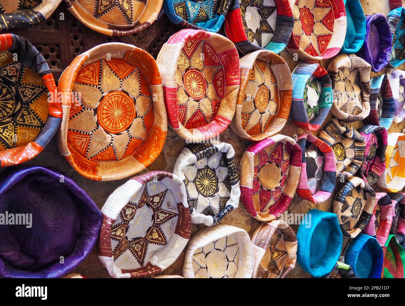 Colourful leather handcraft bowl shaped souvenirs displayed at ...