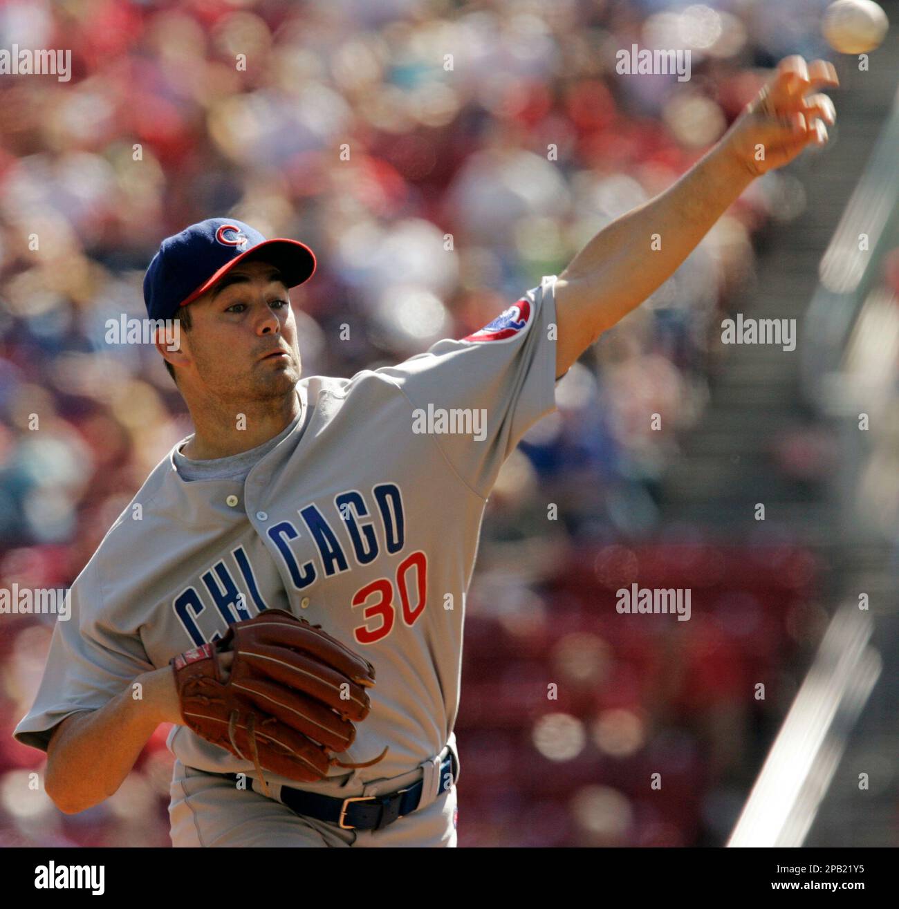 Chicago Cubs' Ted Lilly pitches against the Cincinnati Reds in the ...