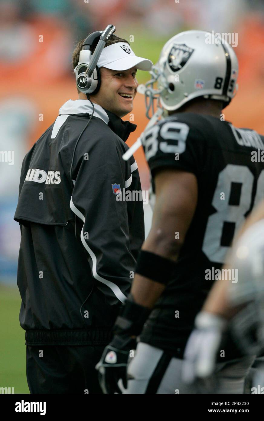 Oakland Raiders coach Lane Kiffin talks to Ronald Curry during the ...