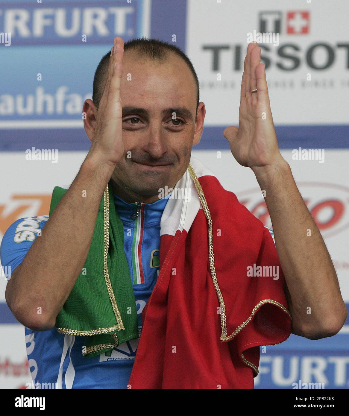 Italia's Paolo Bettini gestures during the victory ceremony after ...