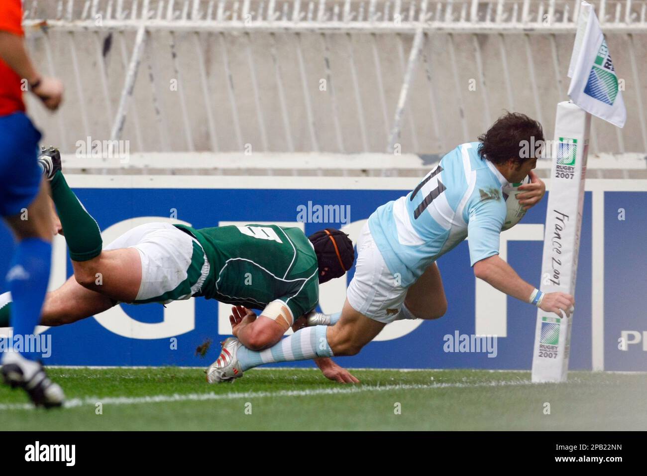 Horacio Agulla of Argentina, right, scores his team's second try during ...
