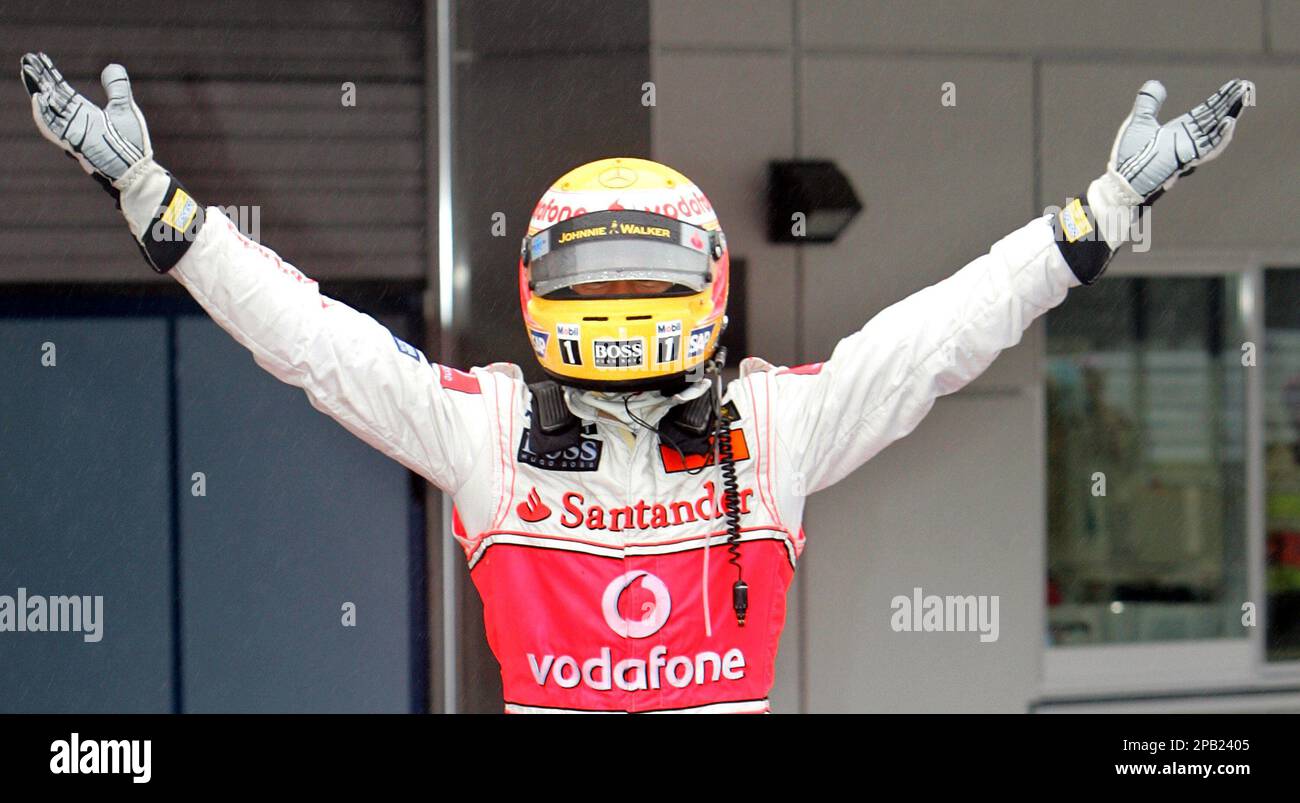 British McLaren-Mercedes driver Lewis Hamilton celebrates after winning ...