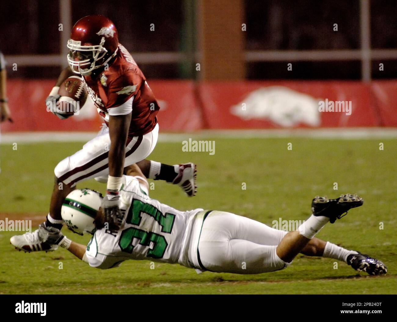 North Texas' Evyn Roman (37) attempts a tackle on Arkansas' Brandon ...