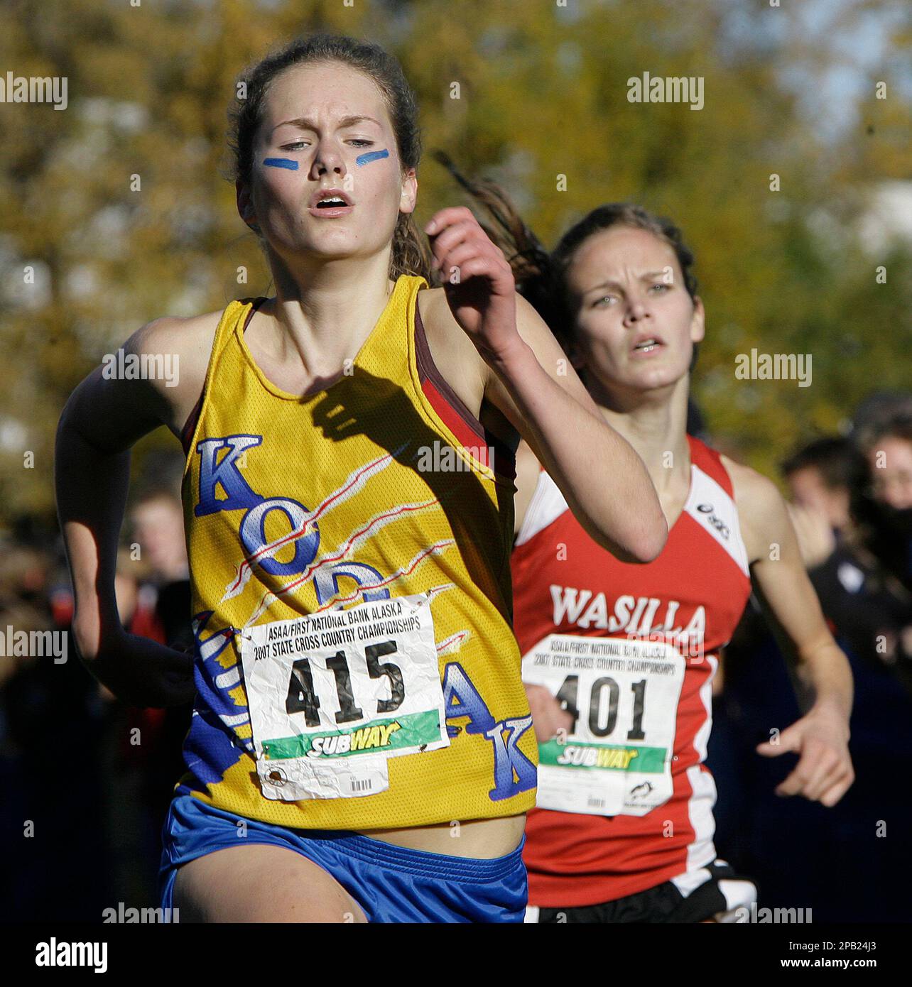 Kodiak's Abby Reed, left, races Wasilla's Kendra Nelson to the finish ...