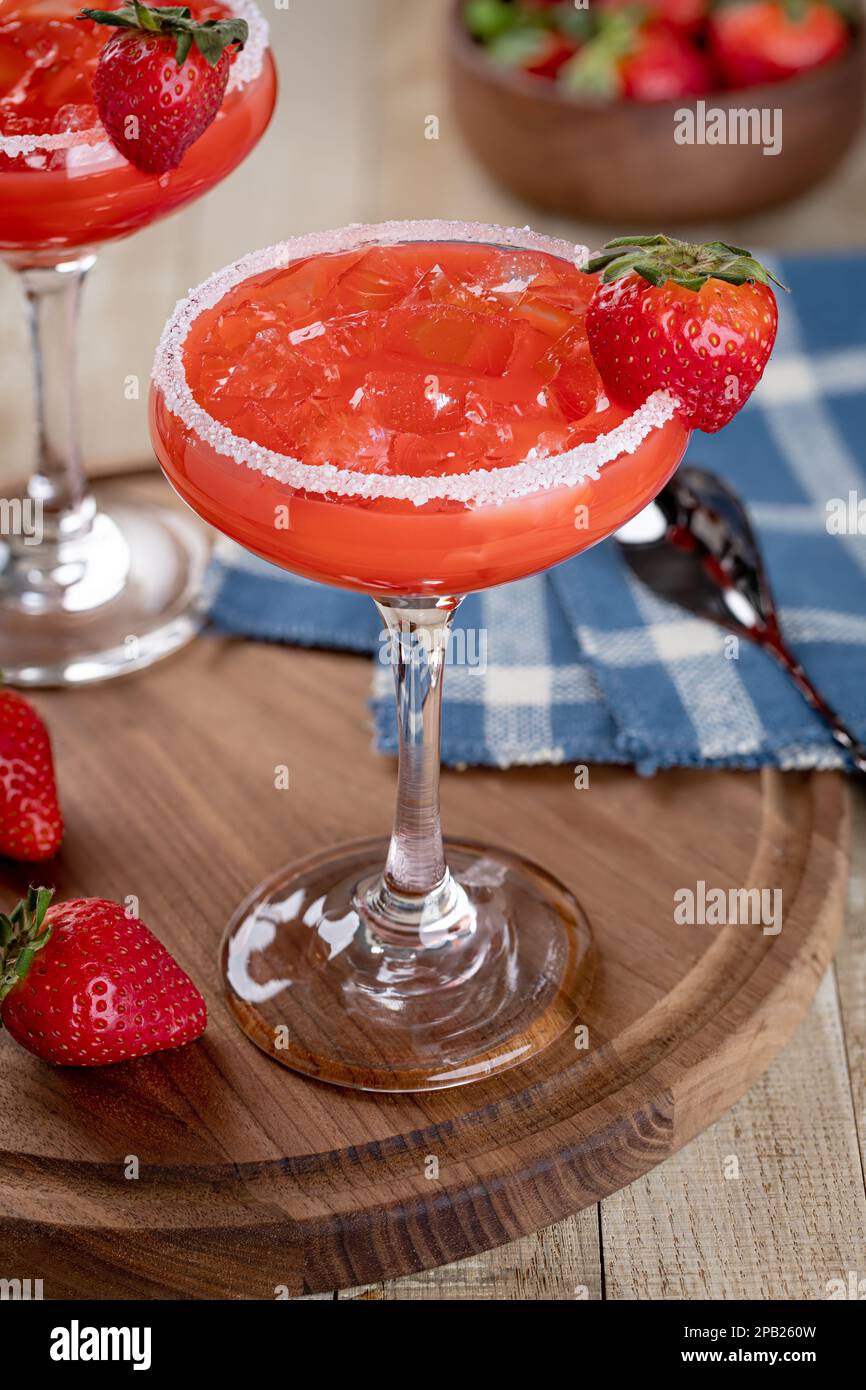 Strawberry margarita cocktail garnished with strawberries and salt rim ...