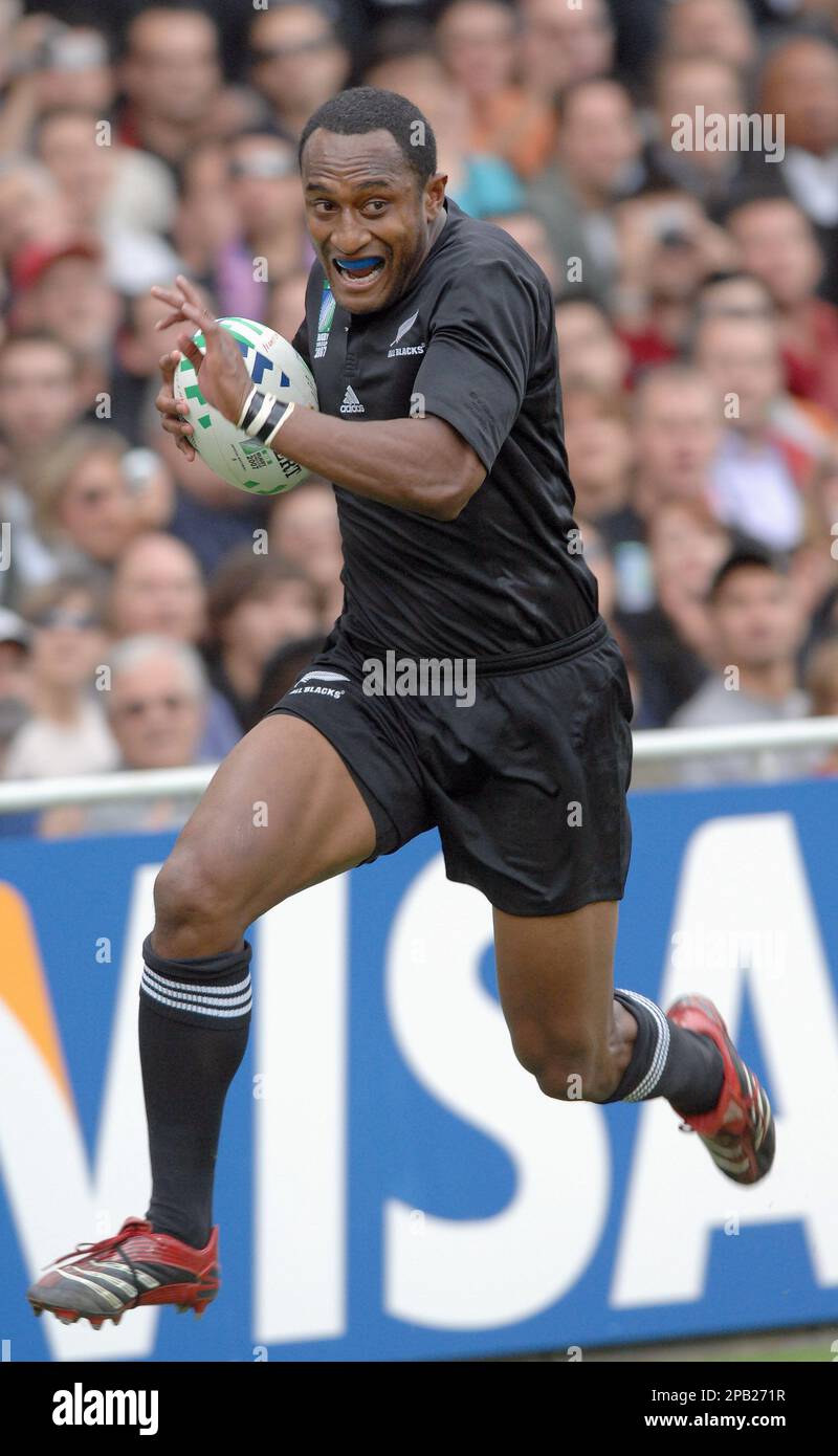 Joe Rokocoko of New Zealand runs through to score a try during the ...