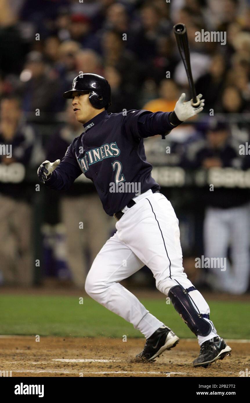 Seattle Mariners' Kenji Johjima follows through as he hits a double ...