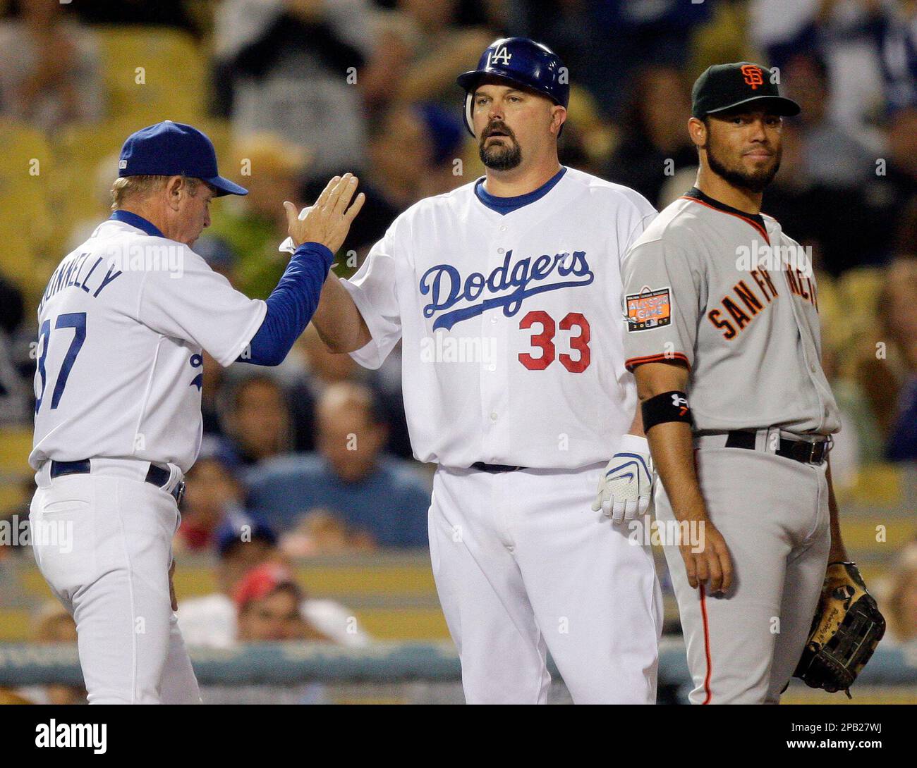 Los Angeles Dodgers pitcher David Wells, center, is congratulated by ...