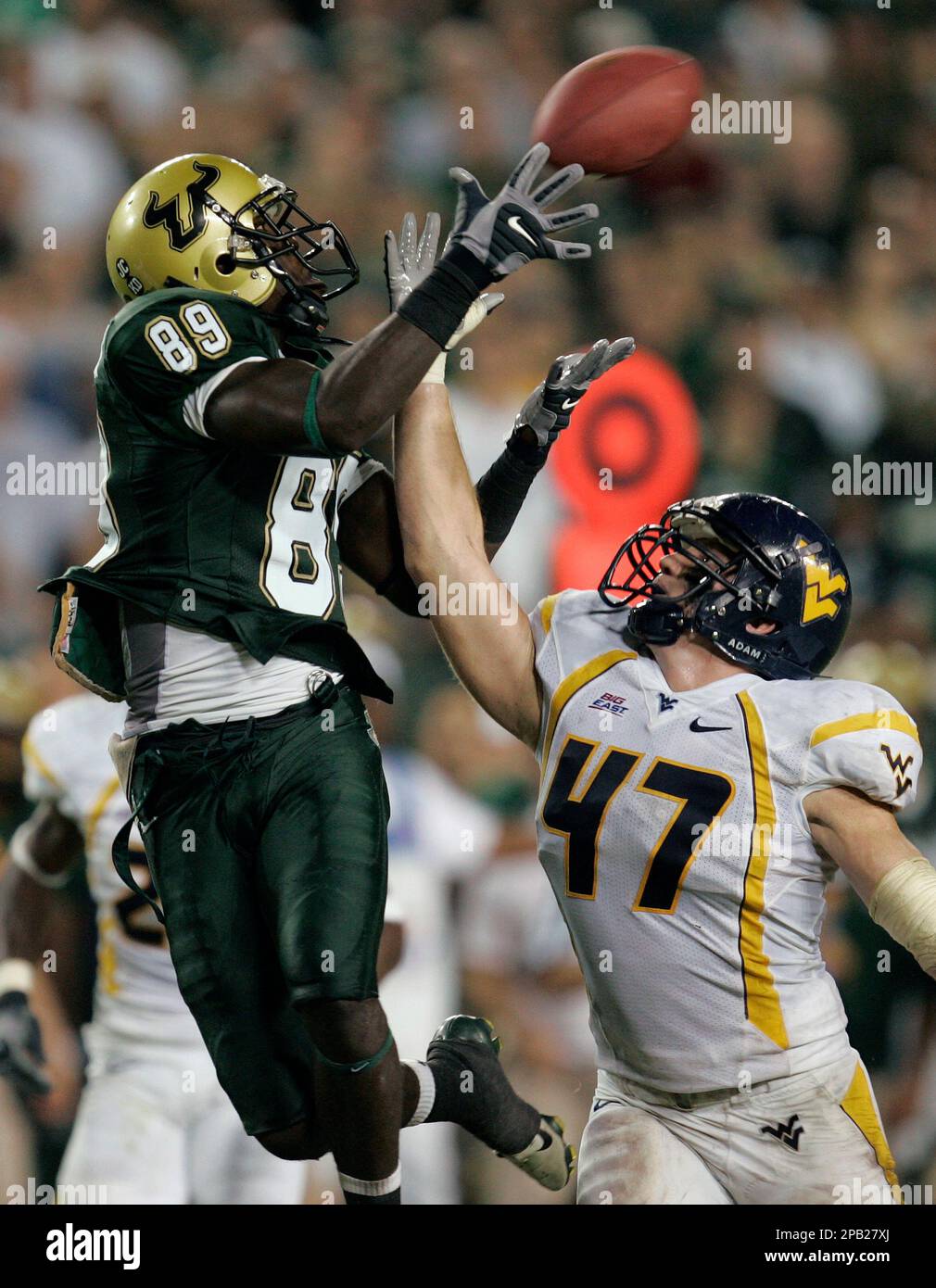 South Florida's Taurus Johnson (89) goes up over West Virginia Reed ...