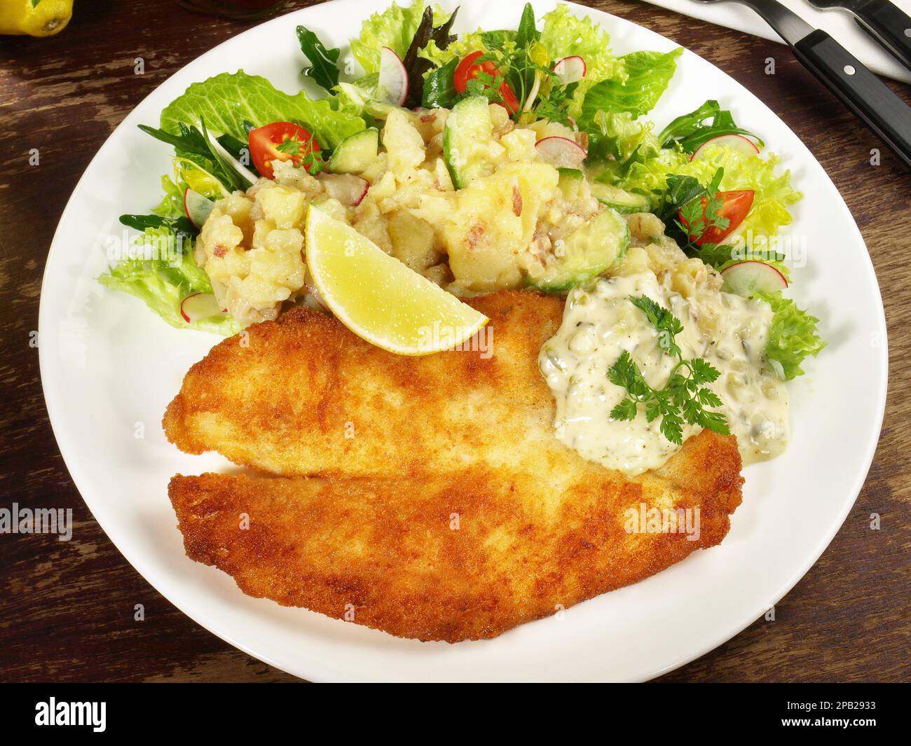 Fried Fish with Potato Salad Stock Photo - Alamy