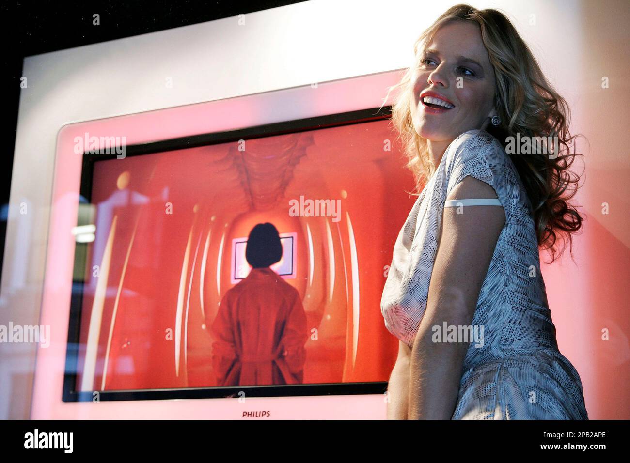 Czech model Eva Herzigova poses in a shop window as she launches a new ...