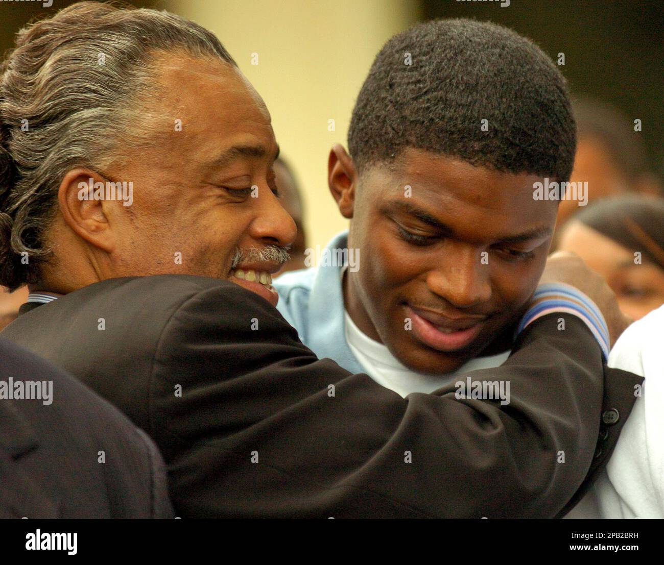 Mychal Bell, right, one of the Jena Six, hugs Rev. Al Sharpton after ...