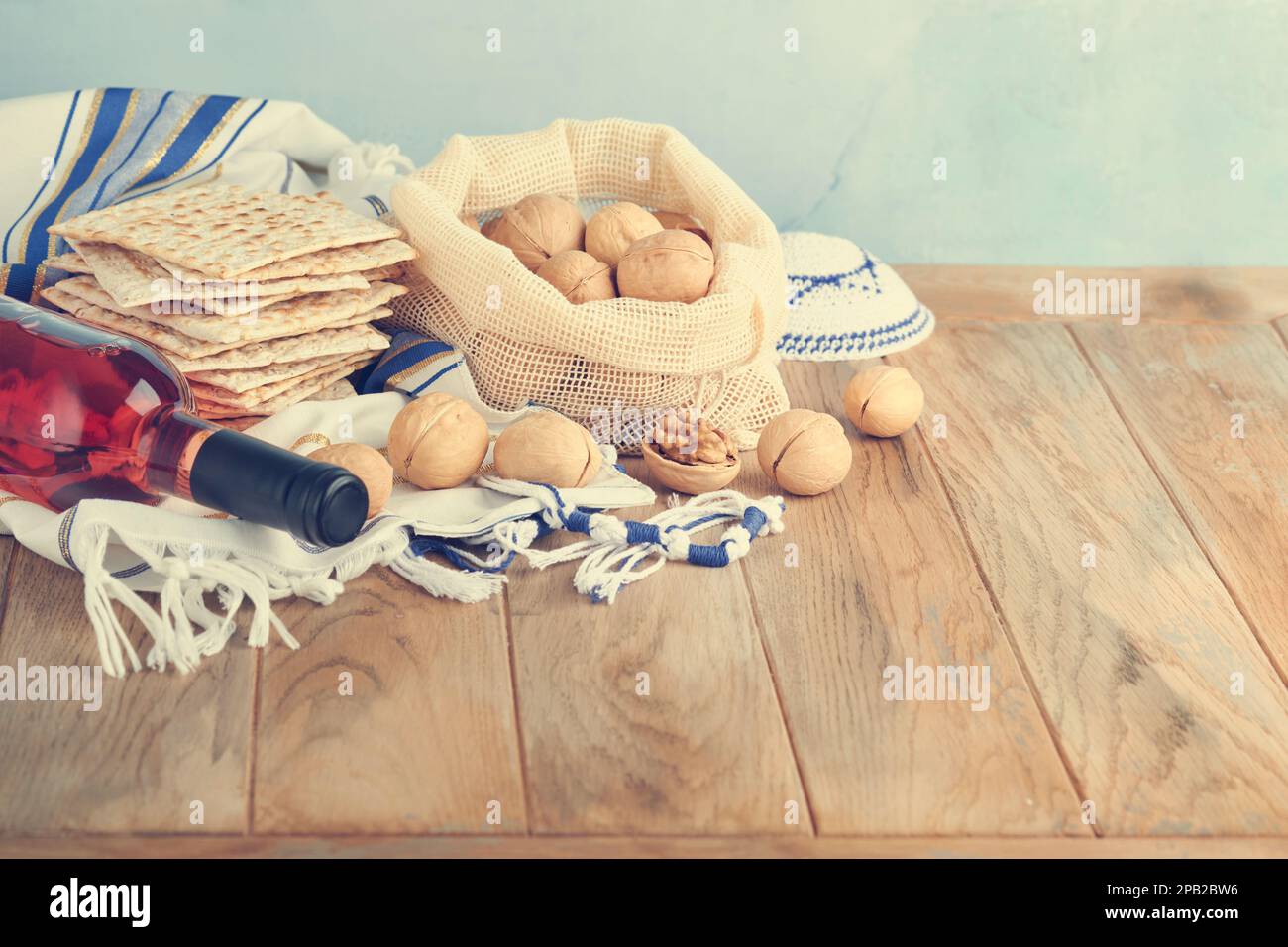 Passover celebration concept. Matzah, red kosher and walnut ...