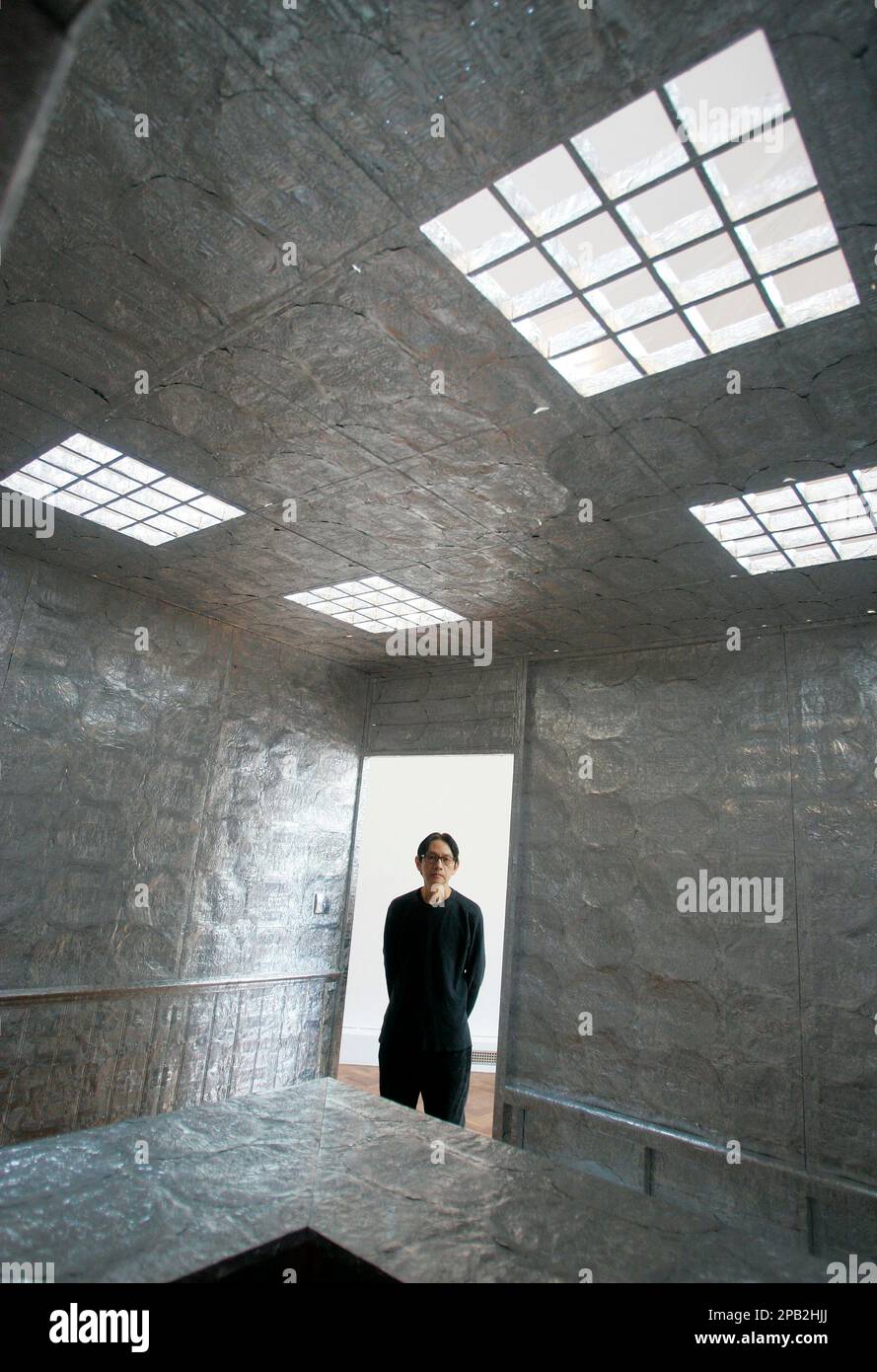 British-Chinese sculptural artist Anthony Key stands in his full scale ...