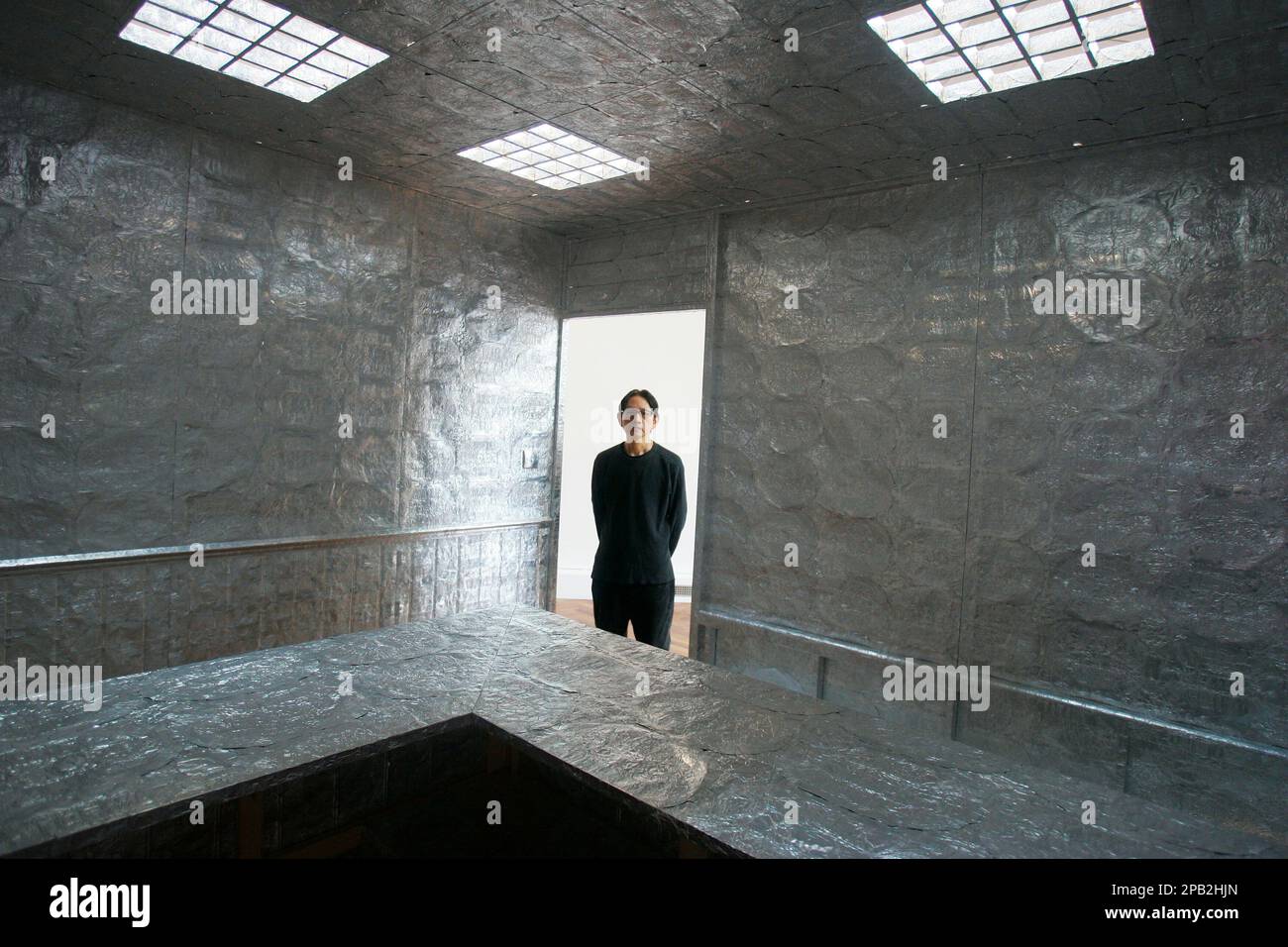 British-Chinese sculptural artist Anthony Key stands in his full scale ...