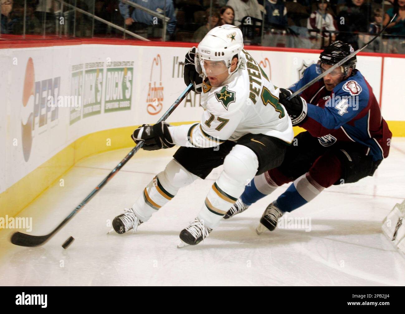 Dallas Stars center Toby Petersen (17) chases the puck as Colorado ...