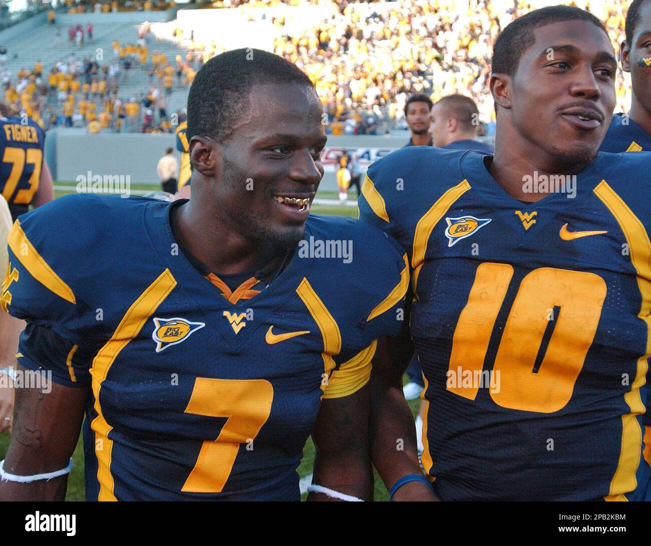 West Virginia's Noel Devine (7) and Steve Slaton (10) share a laugh ...