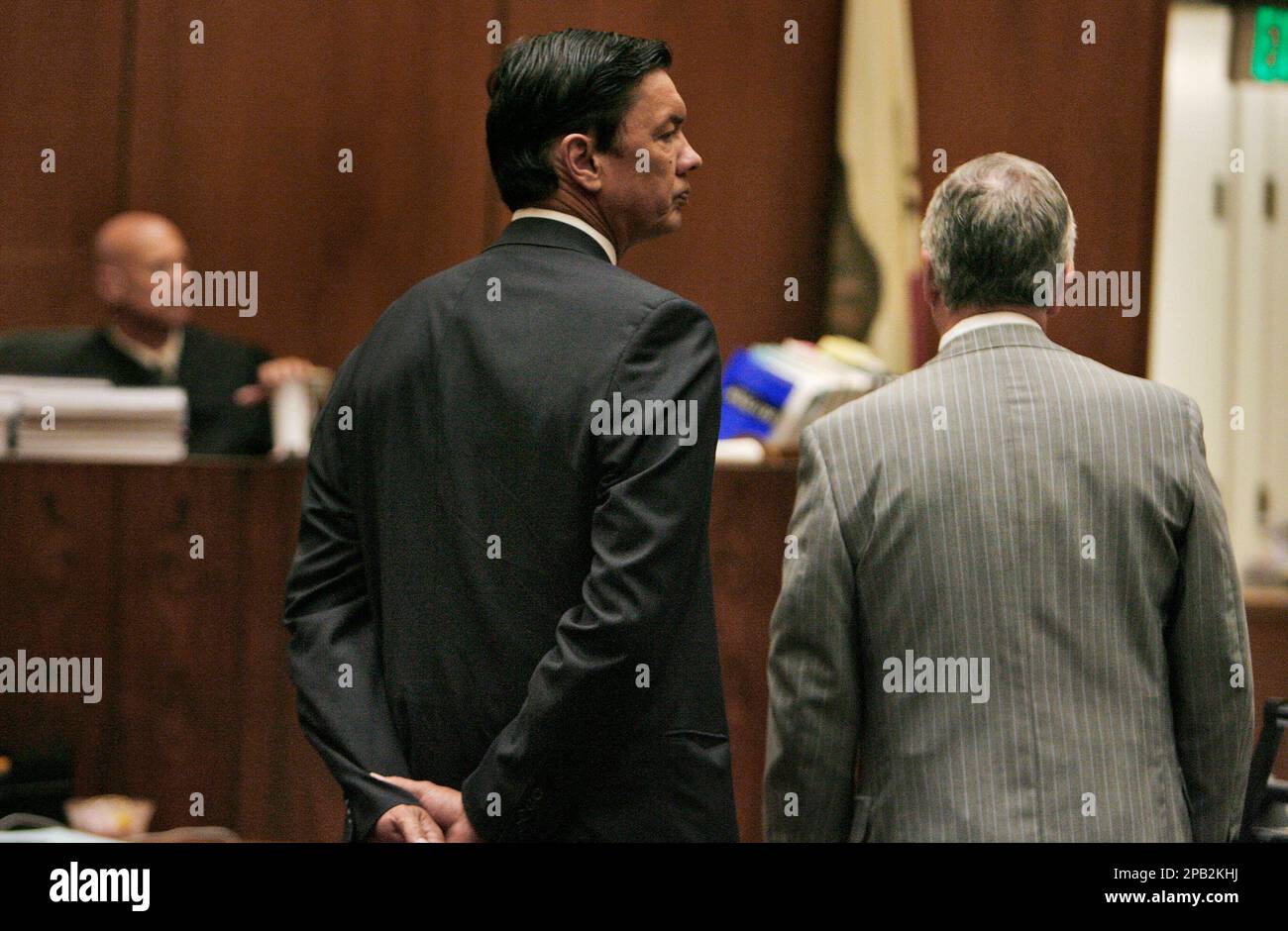 Judge Larry Paul Fidler, left, listens to Roderick Lindblom, center and ...