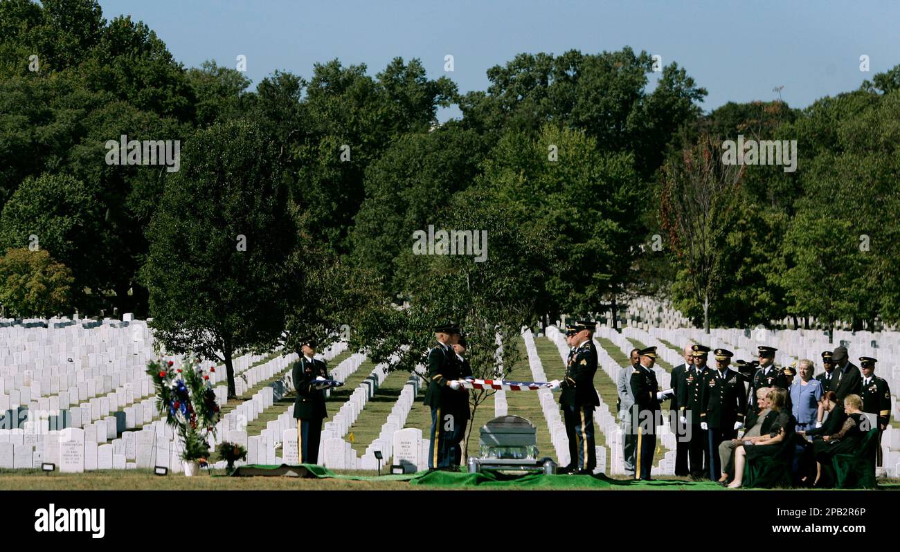 An Army honor guard detail conducts a burial service for Army Staff Sgt ...