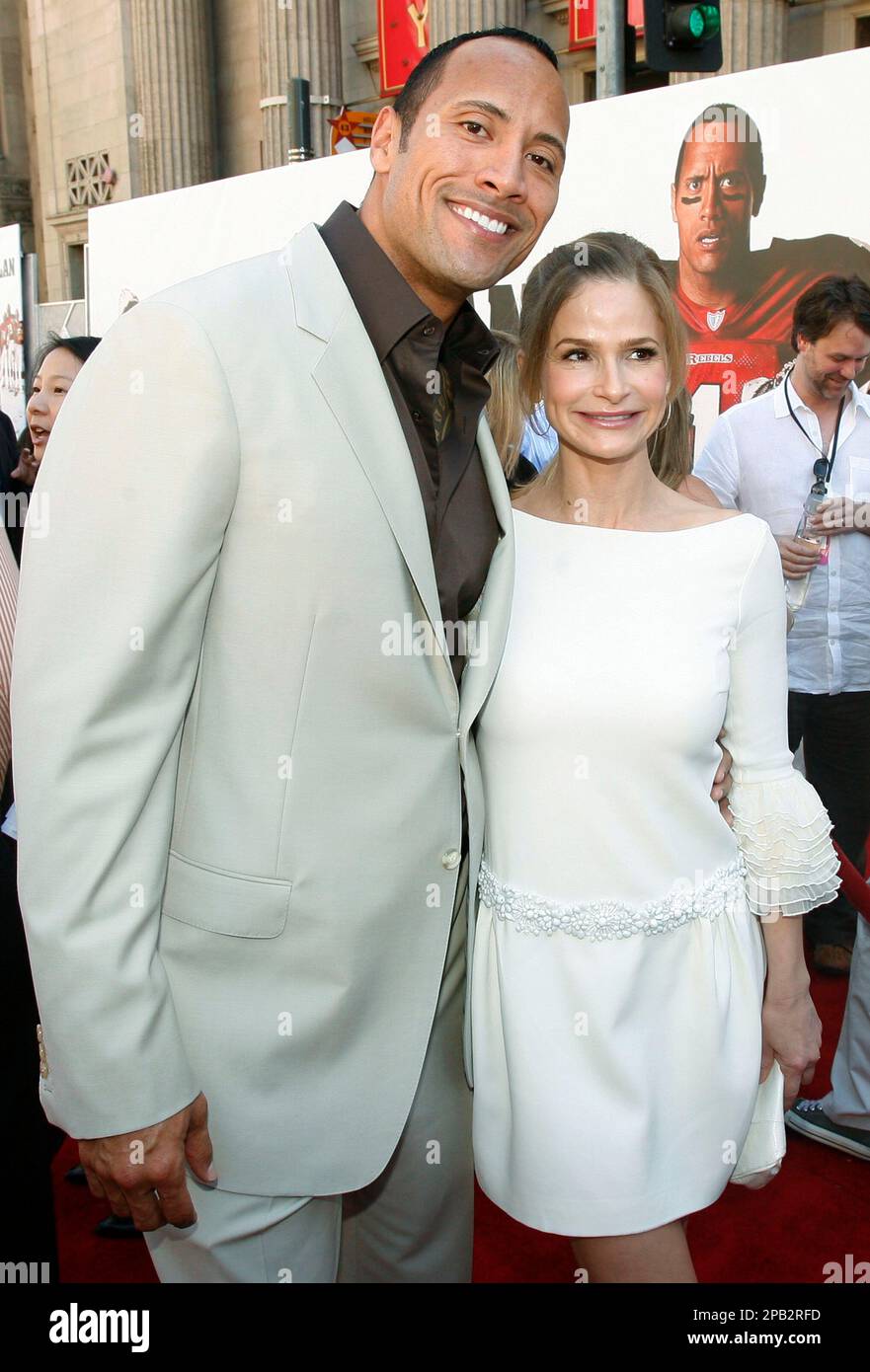 Dwayne "The Rock" Johnson, left, and Kyra Sedgwick pose together at the ...