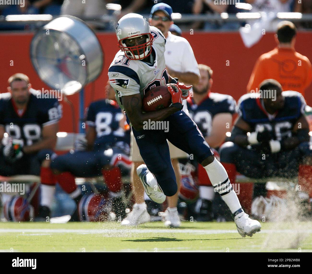 New England Patriots receiver Randy Moss runs after a catch during the ...