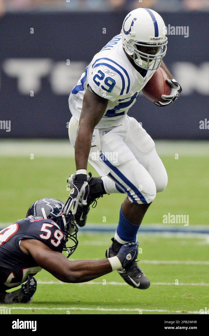 Indianapolis Colts running back Joseph Addai (29) slips away from ...