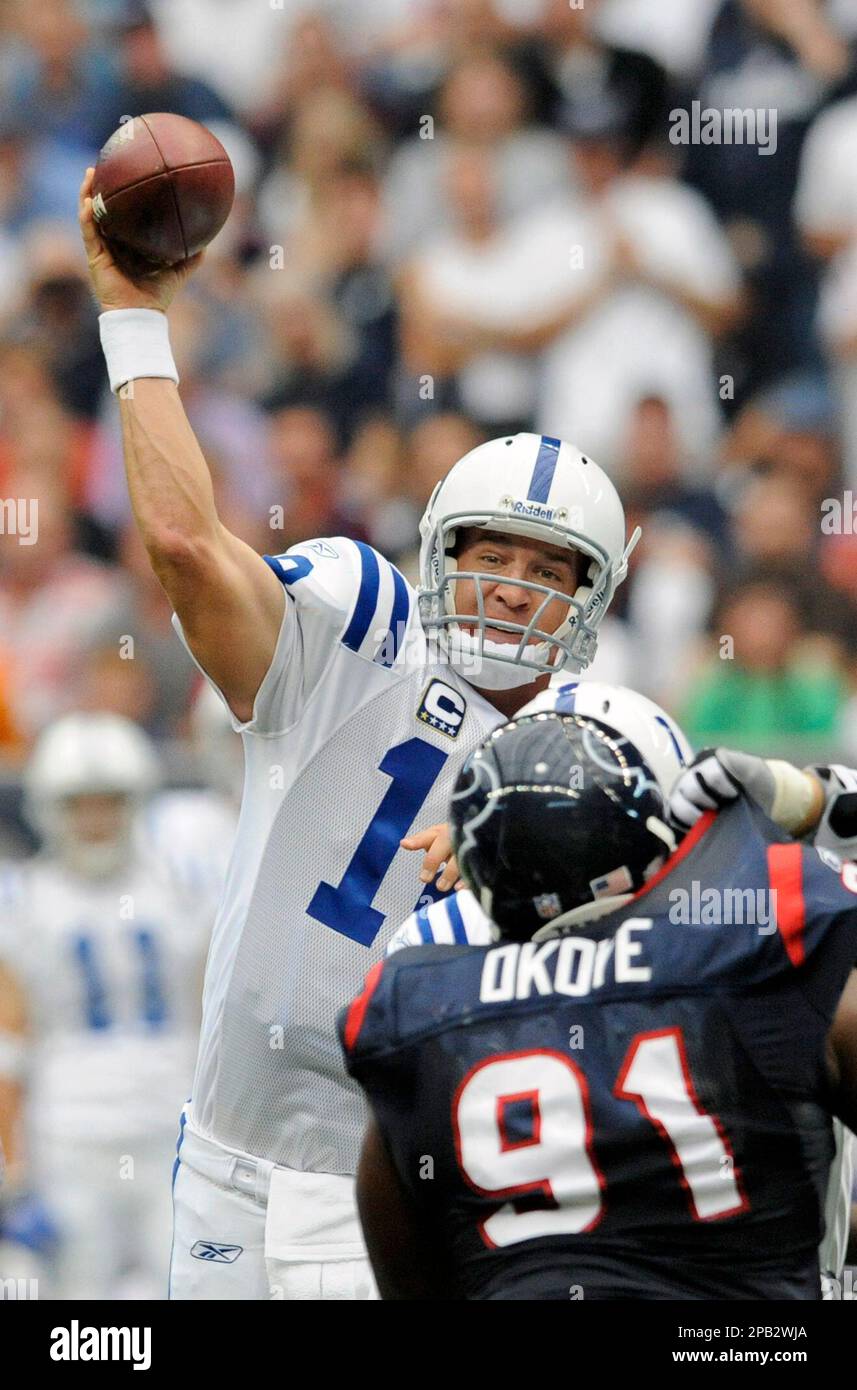 Indianapolis Colts quarterback Peyton Manning, left, throws a pass as ...