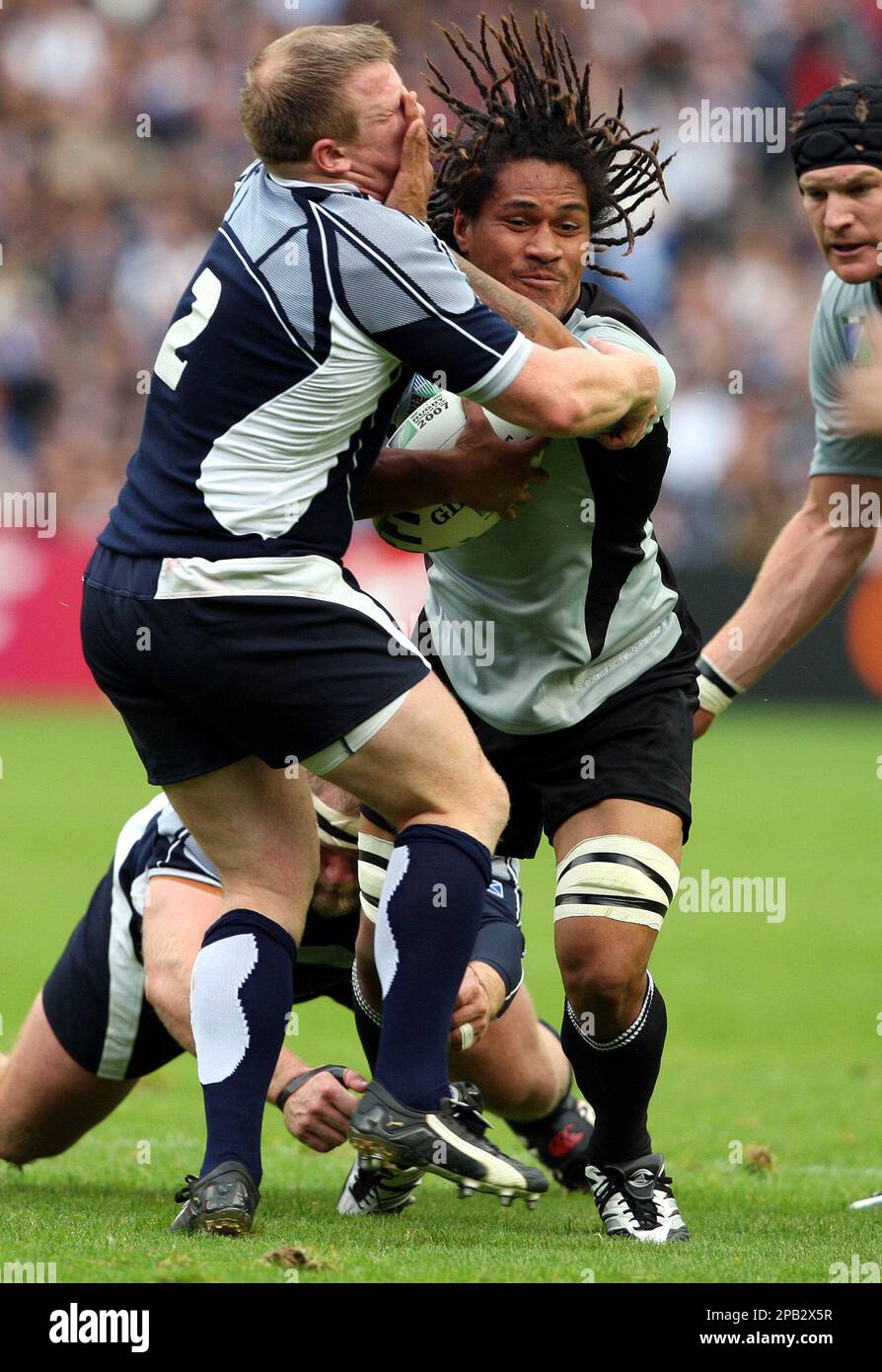 Rodney So'oialo of New Zealand, right, battles his way past Scotland's ...