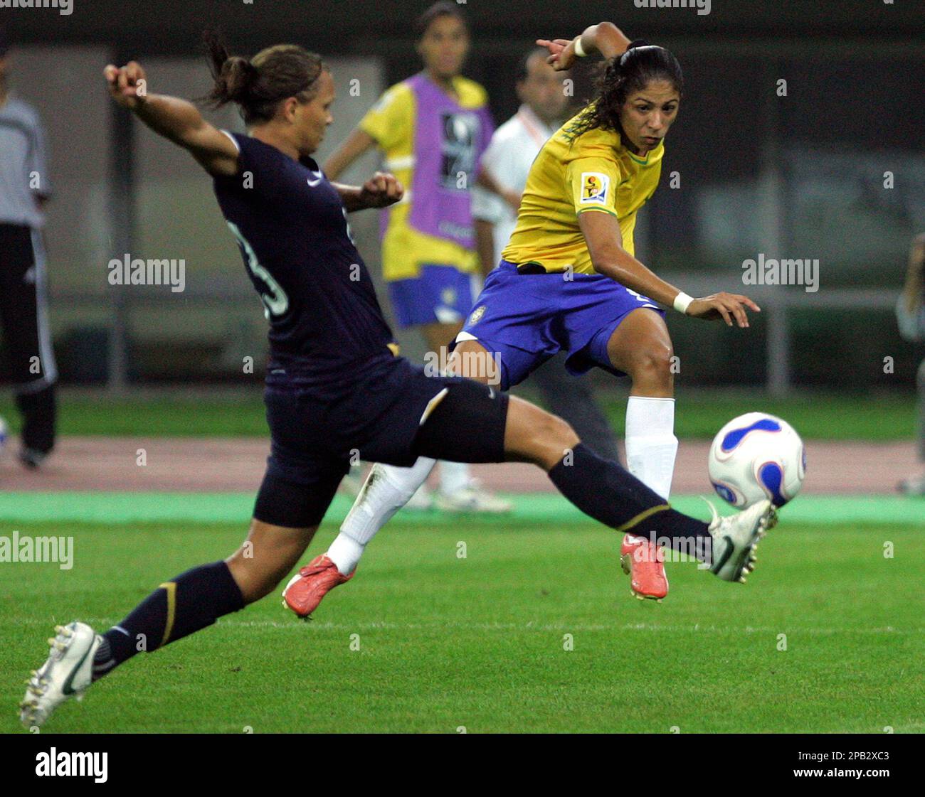 Brazil's Cristiane, right, kicks the ball as Australia's Thea Slatyer ...