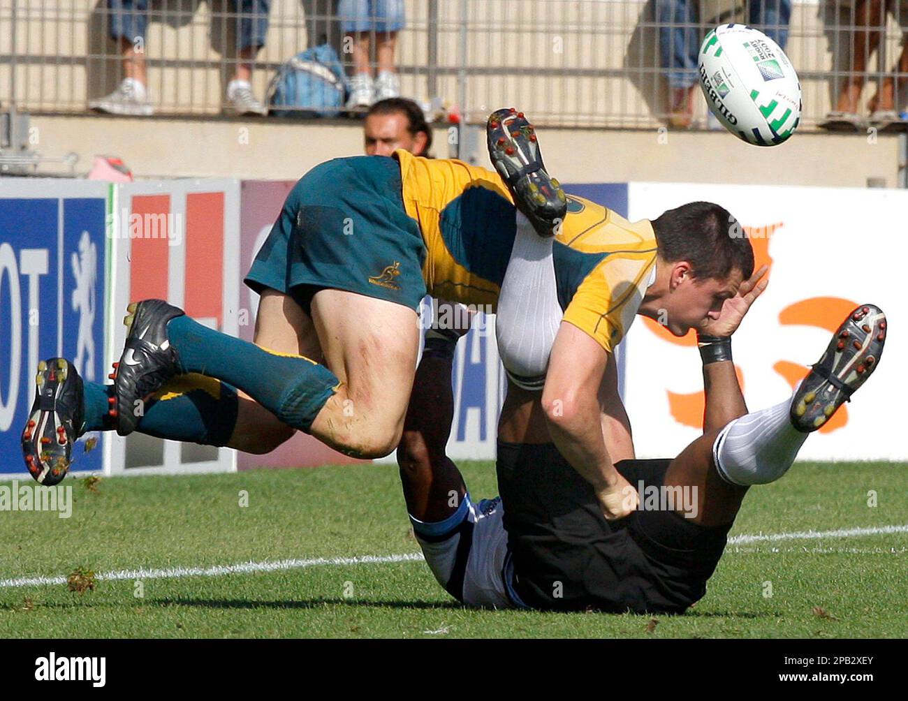 Australia's Adam Ashley-Cooper, top, spills the ball in a challenge ...