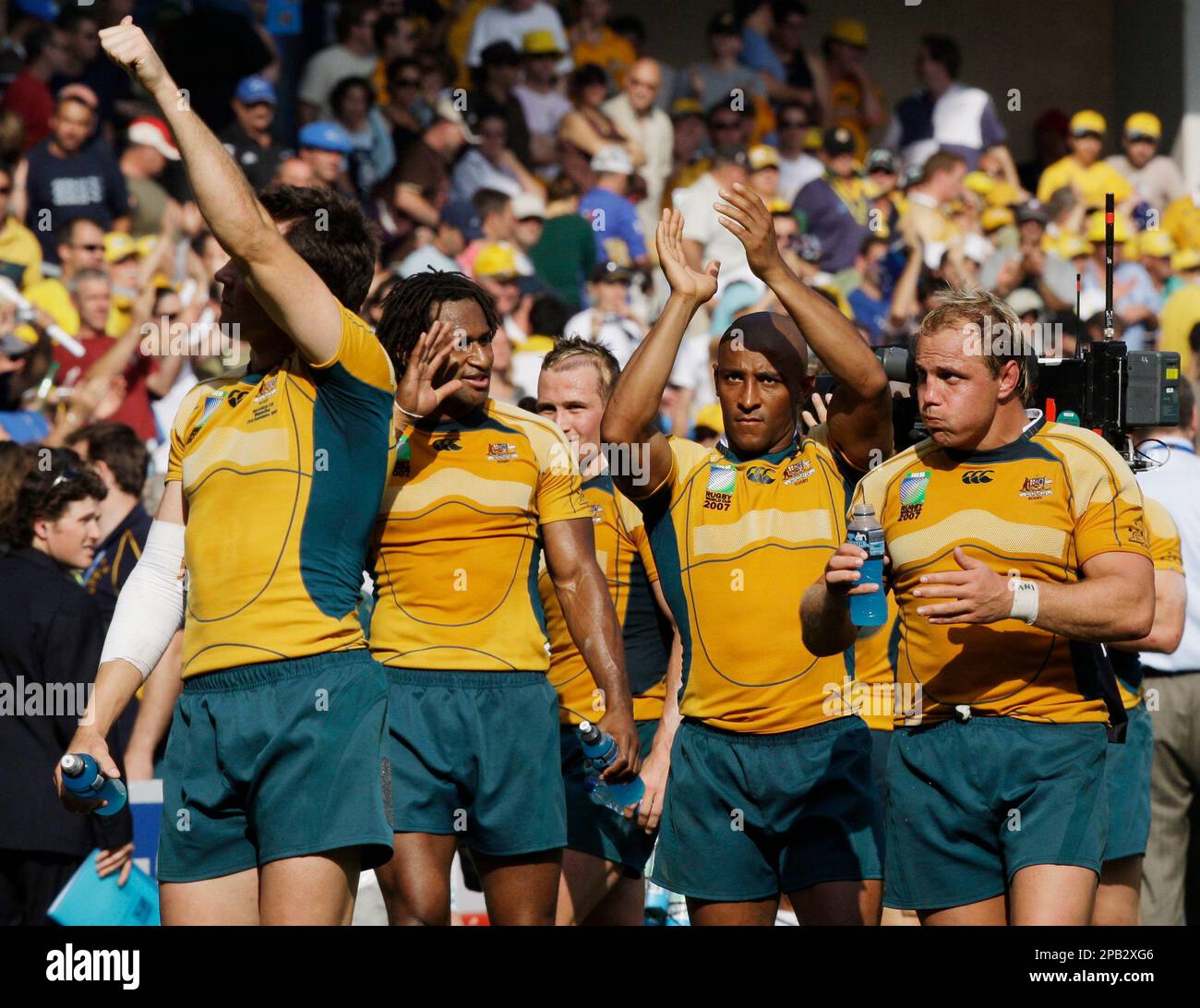 Australian players, from left, Julian Huxley, Lote Tugiri, Matt Giteau ...
