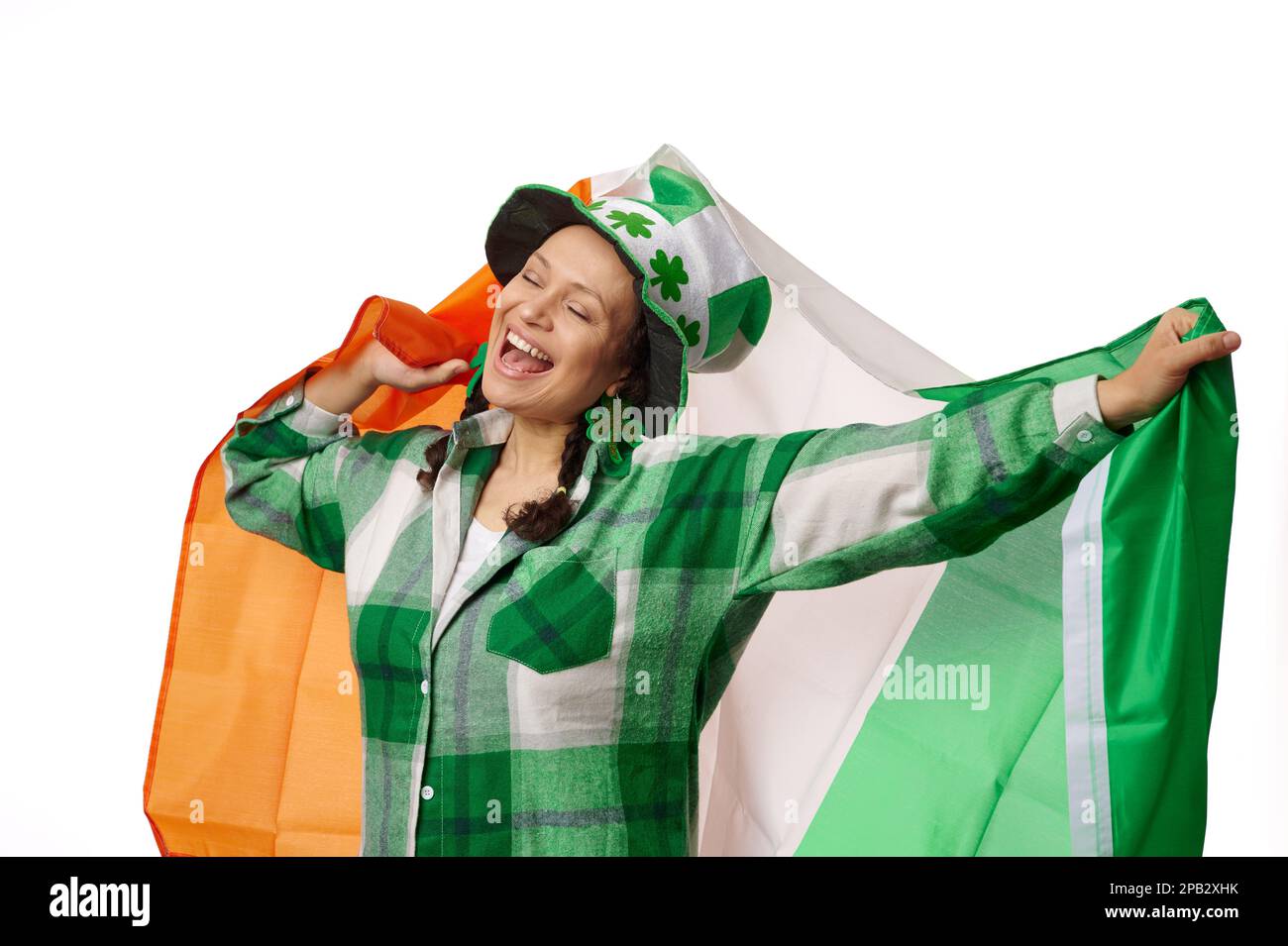 Happy woman carrying Irish flag, celebrating Saint Patrick's Day on ...