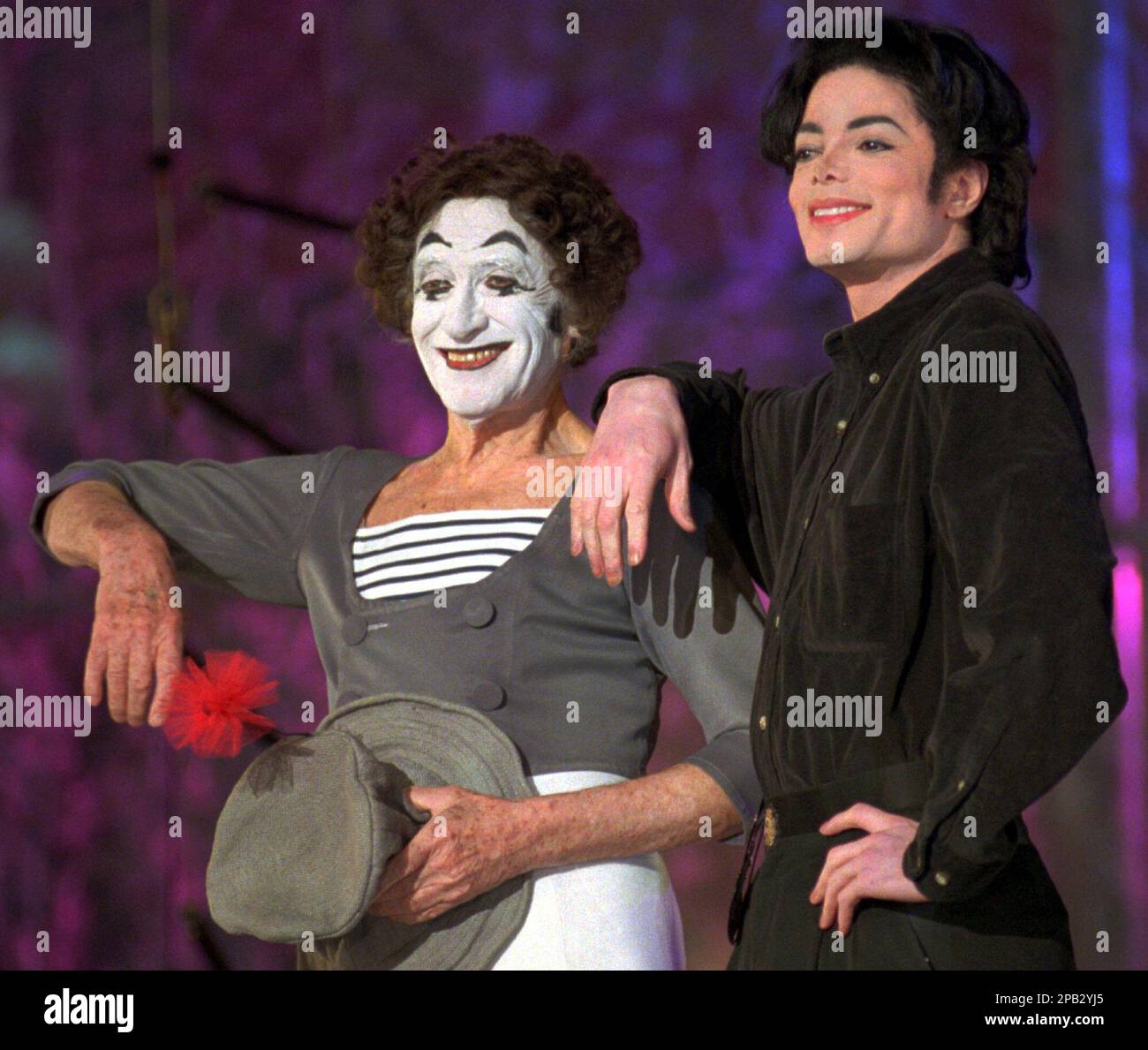 ** FILE ** Entertainer Michael Jackson, right, poses with French mime ...