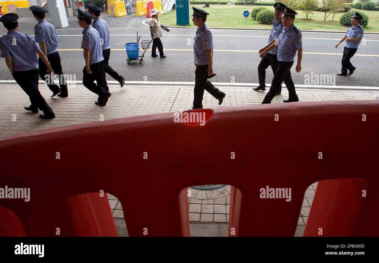Chinese police officers prepare for duty ahead of a quarterfinal match ...
