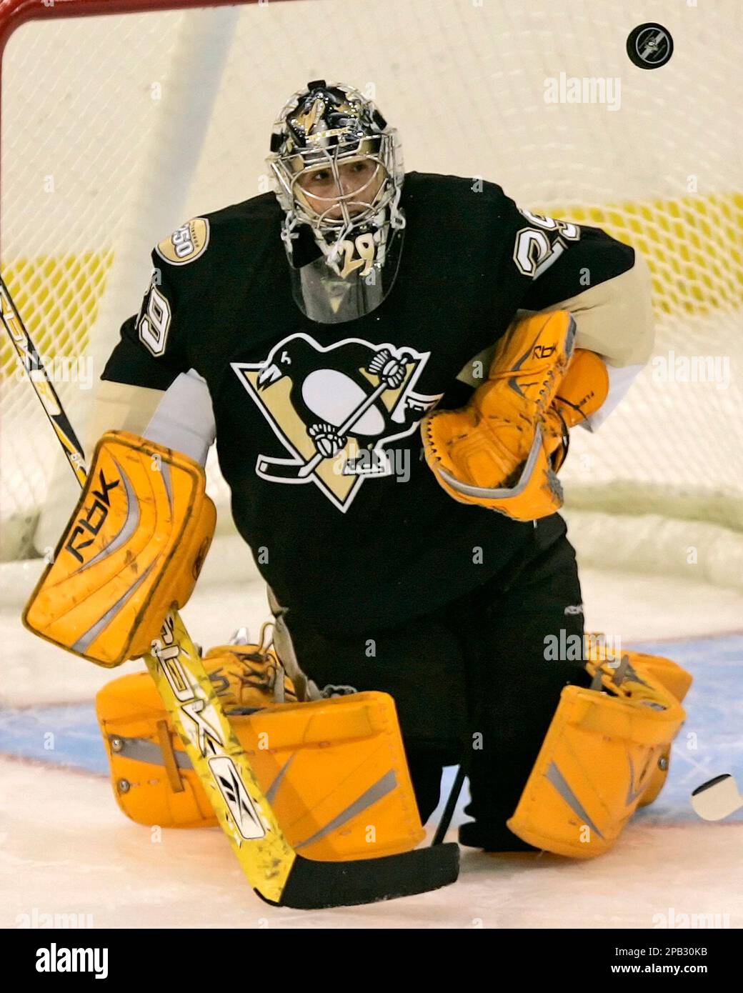 Pittsburgh Penguins' goalie Marc-Andre Fleury watches a rebound during ...