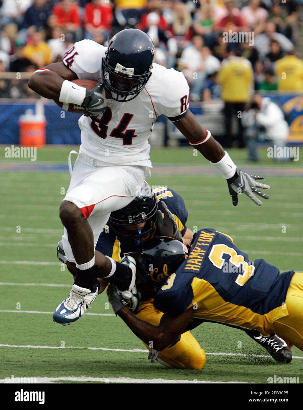 Arizona wide receiver Terrell Turner (84) slips tackles from California ...
