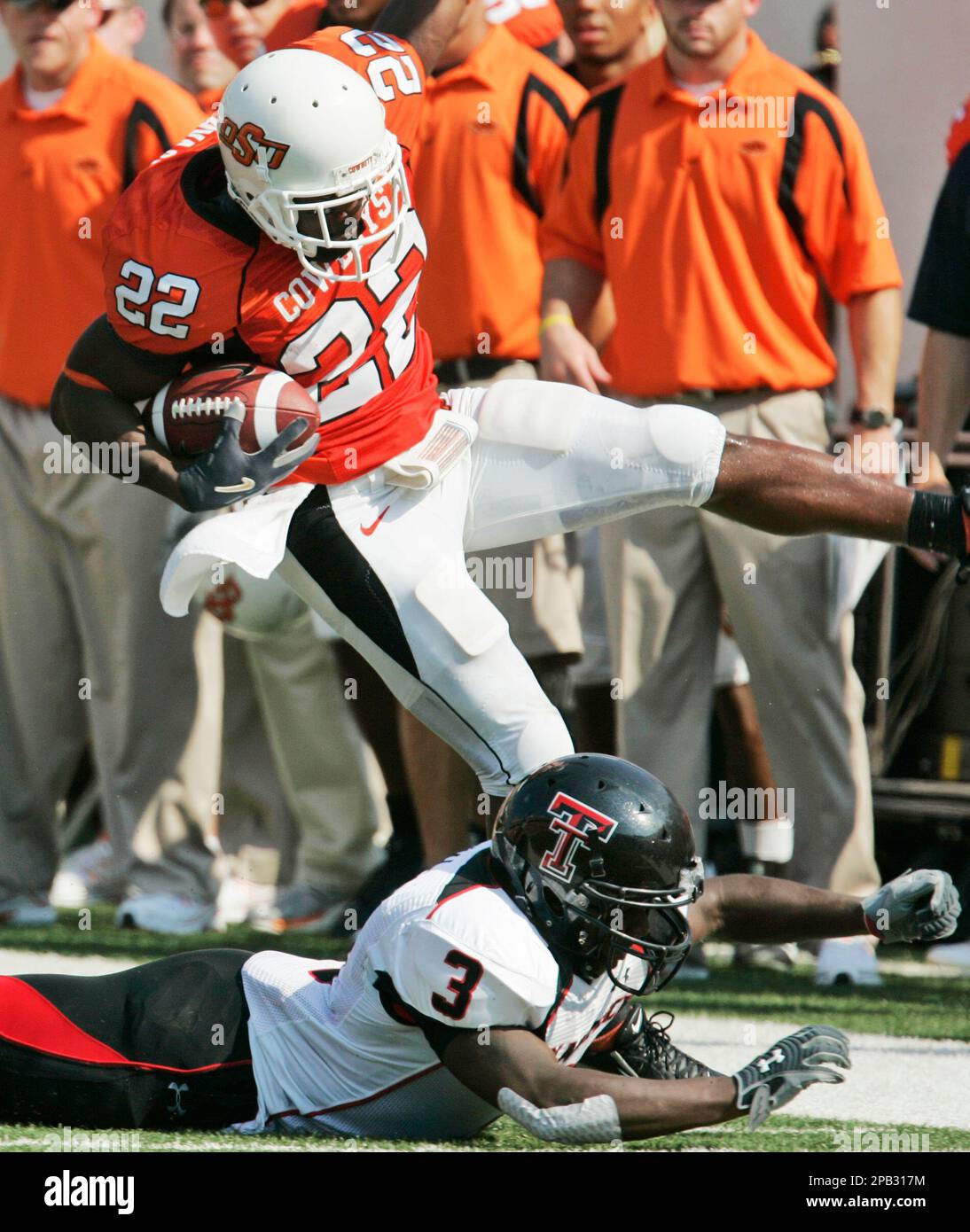 Oklahoma running back Dentrell Savage, top, is spun out of bound by ...