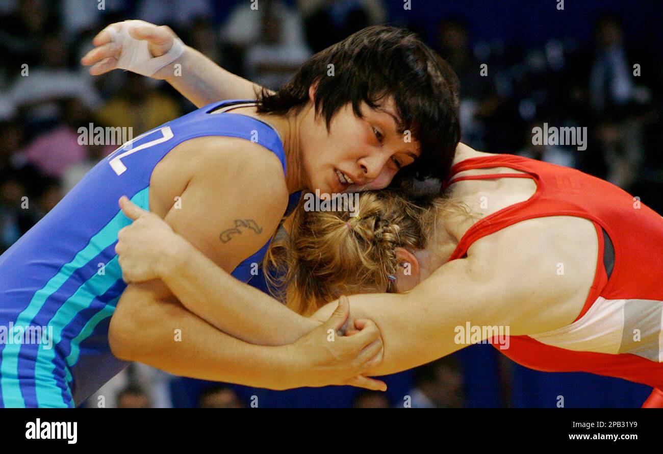 Canada's Erica Sharp, right, wrestles with Kazakhstan's Tatyana ...