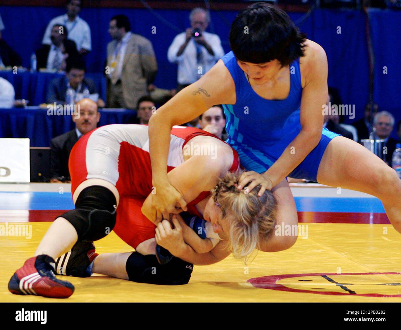 Canada's Erica Sharp, left, wrestles with Kazakhstan's Tatyana Bakatyuk ...