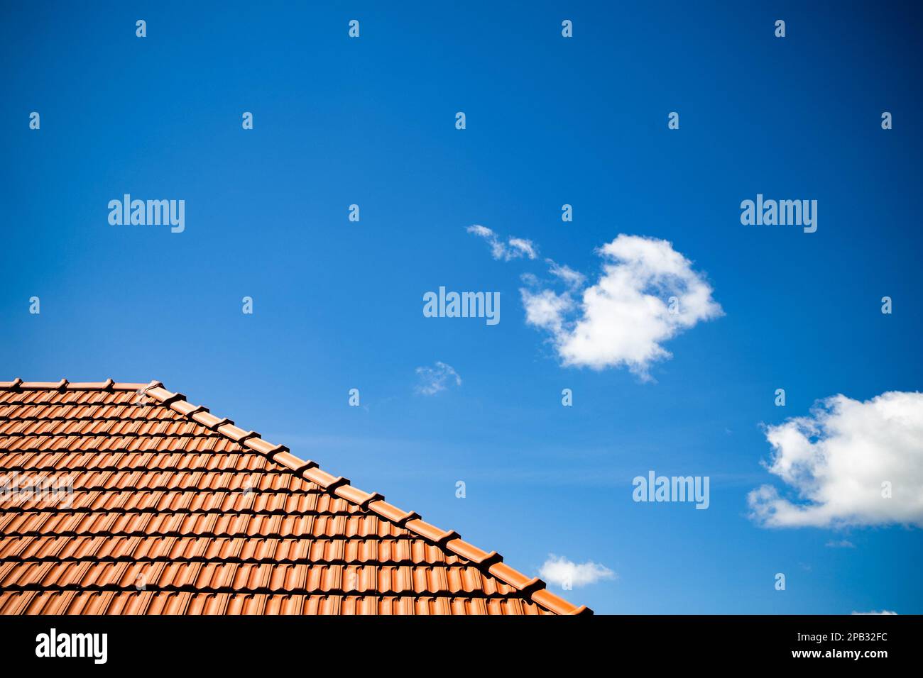 new red tiles roof and blue sky Stock Photo - Alamy